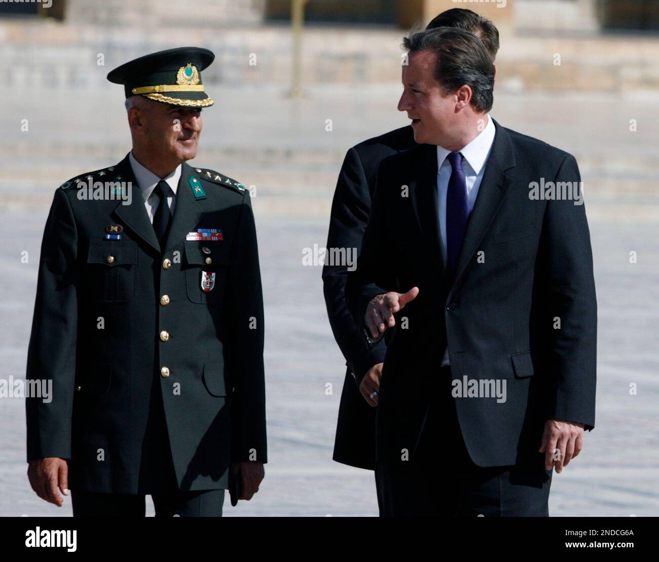 Britain's Prime Minister David Cameron, right, chats with a Turkish ...