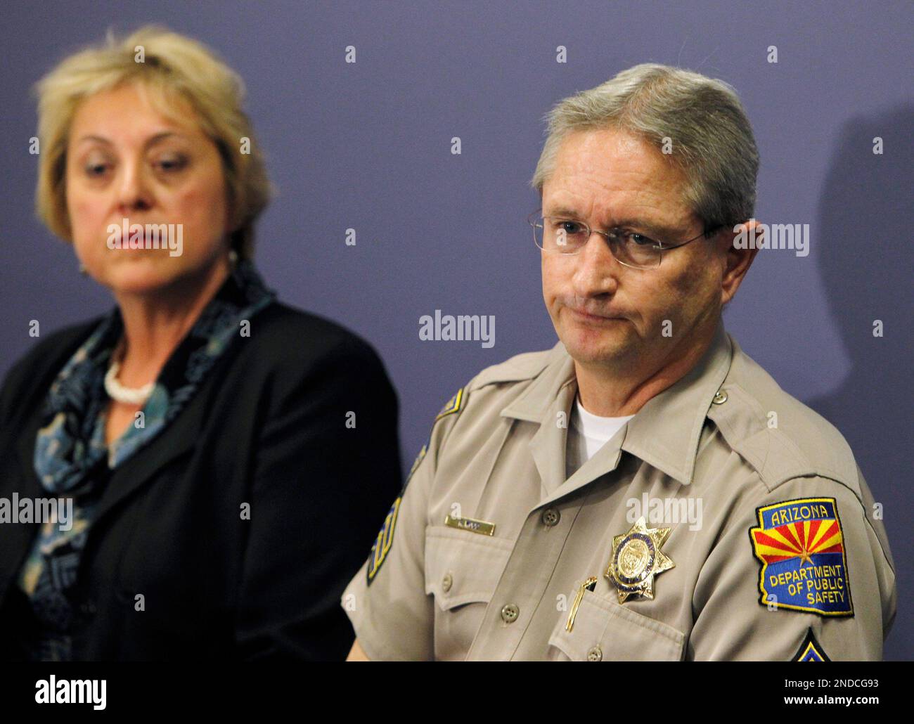 Department of Public Safety spokesman Sgt. Kevin Wood, right, pauses ...