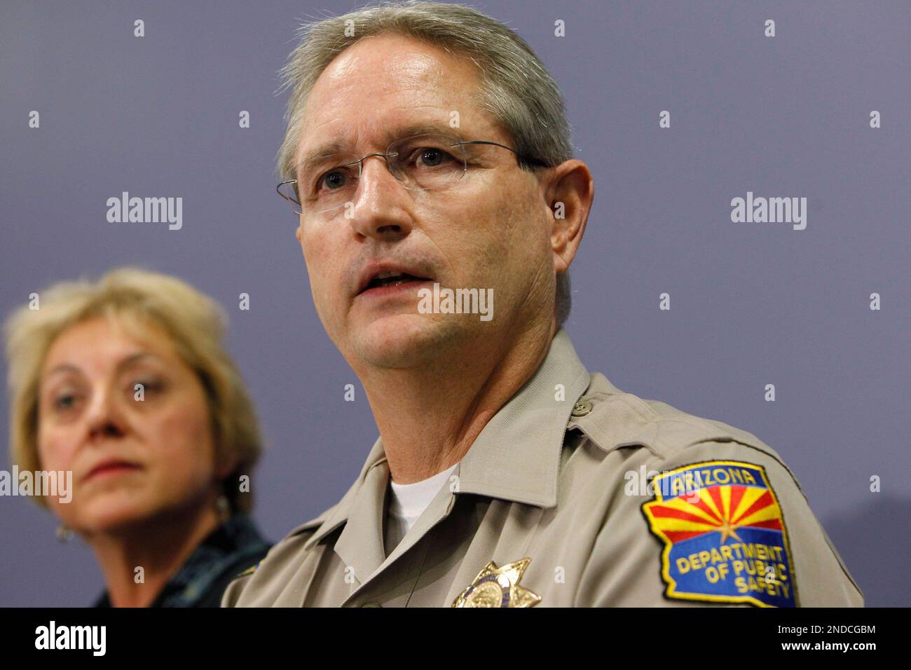 Department of Public Safety spokesman Sgt. Kevin Wood, right, answers a ...