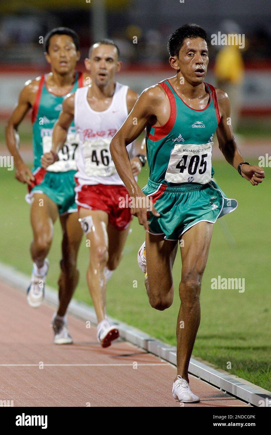 Mexico's Juan Carlos Romero sprints to the finish line followed by ...