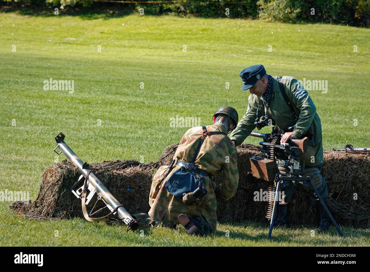WWII German soldiers behind a straw wall with a machinegun and bazooka ...