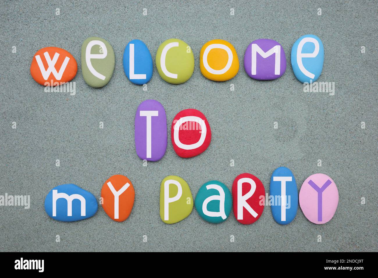 Welcome to my party, creative message composed with multi colored stone ...