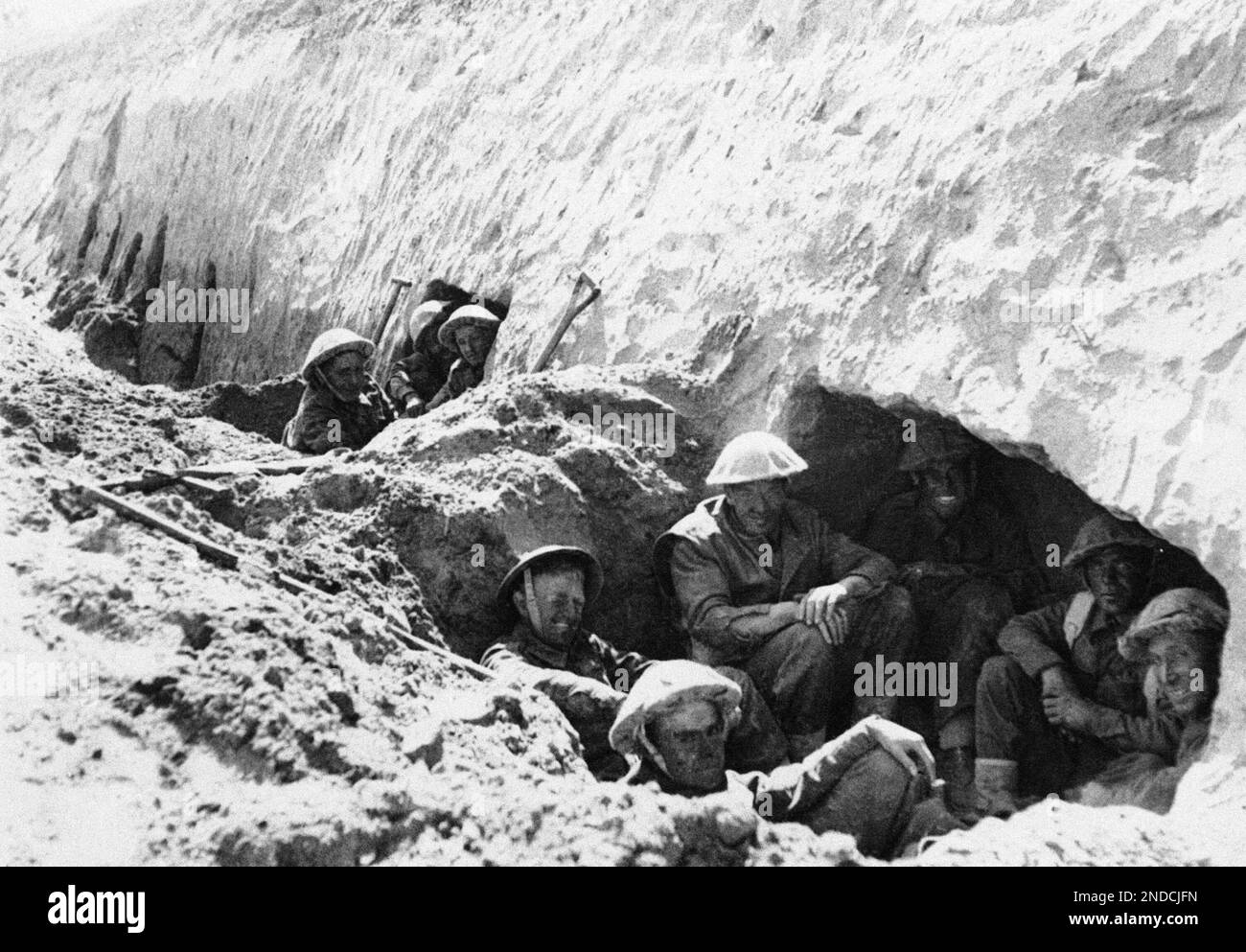 British troops of the Durham Light Infantry wait in “dug-in” positions ...