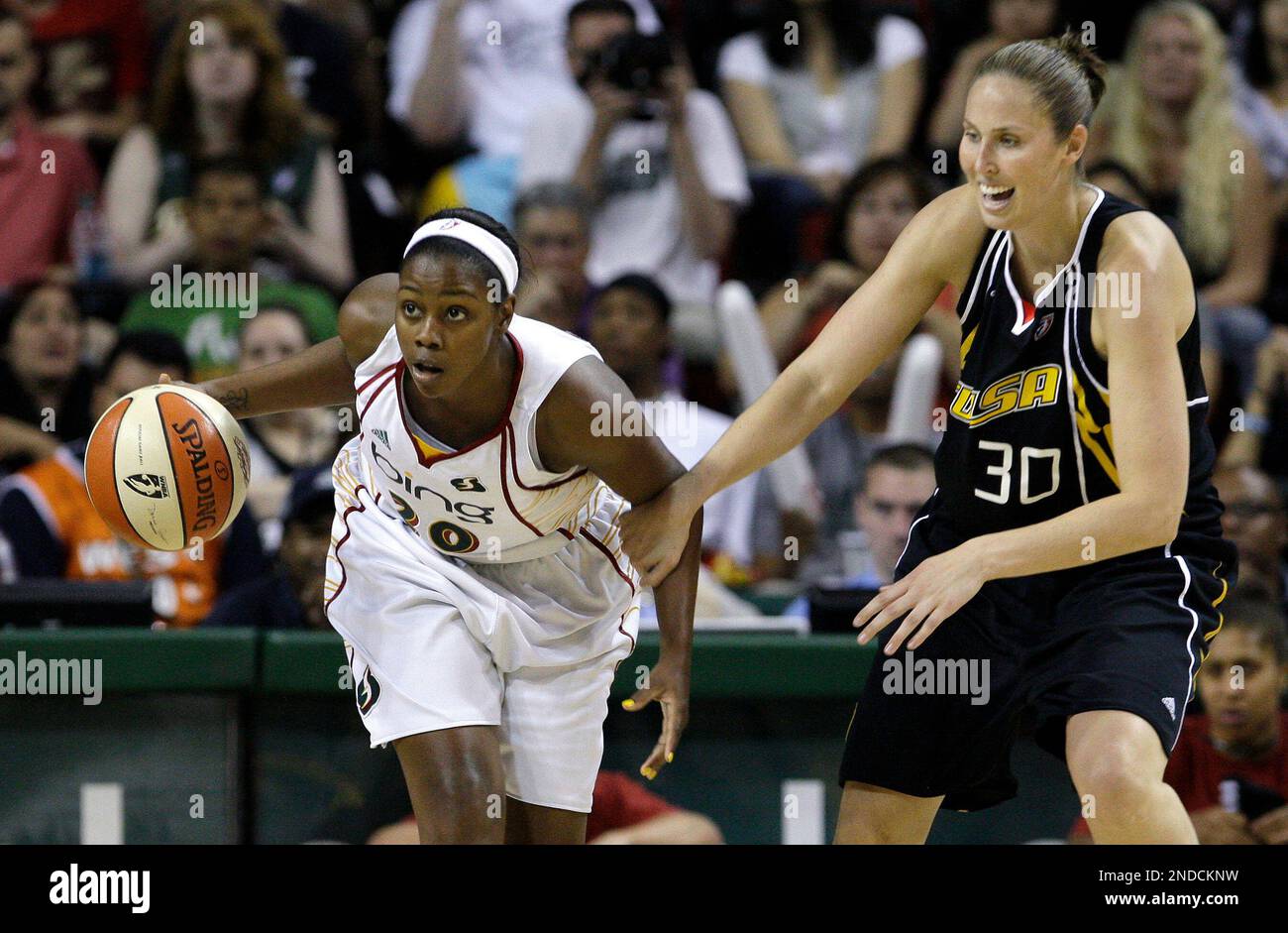 Seattle Storm's Camille Little, left, turns up-court as Tulsa Shock's ...