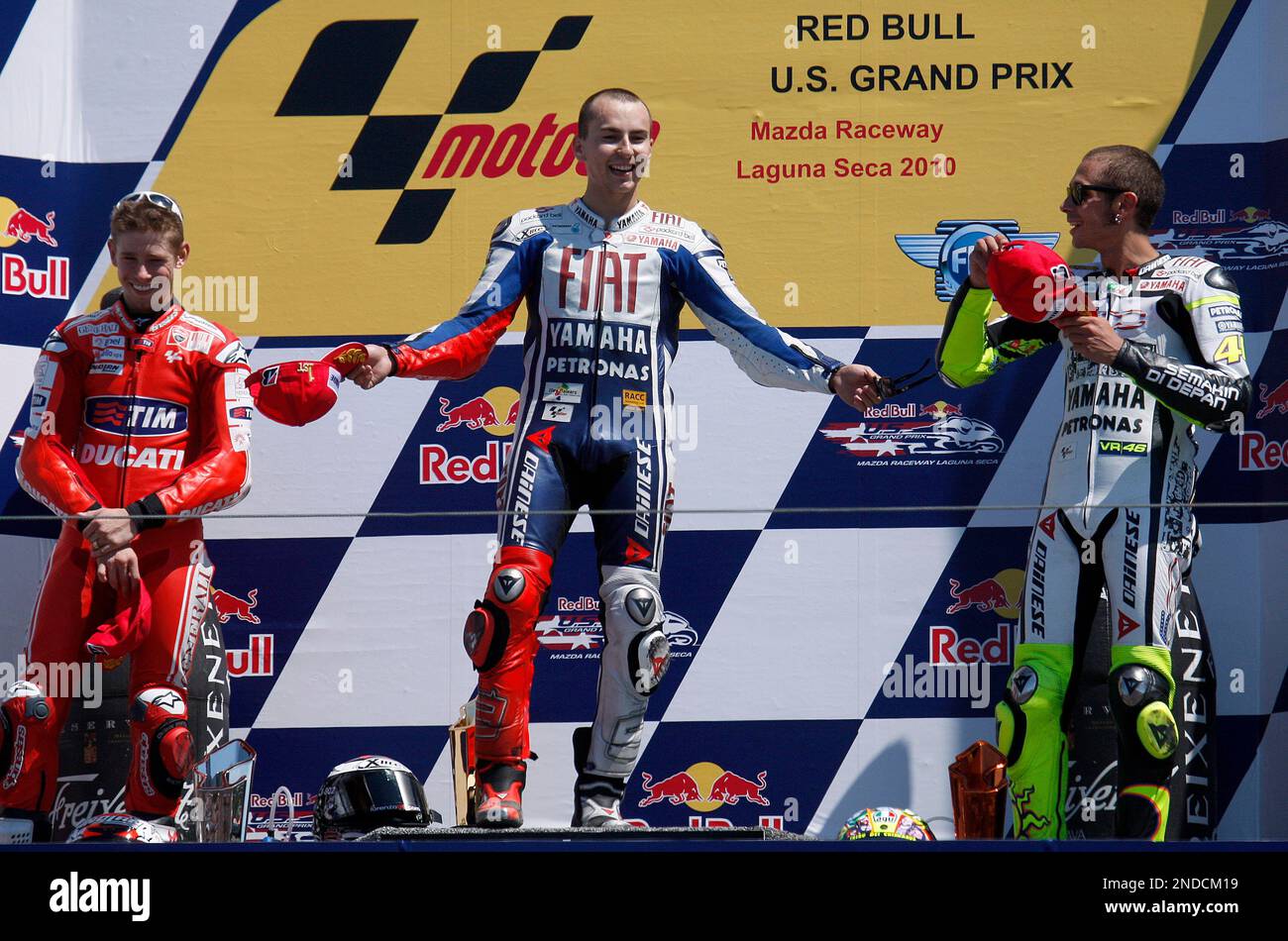 Jorge Lorenzo of Spain, center, celebrates on the podium after winning ...
