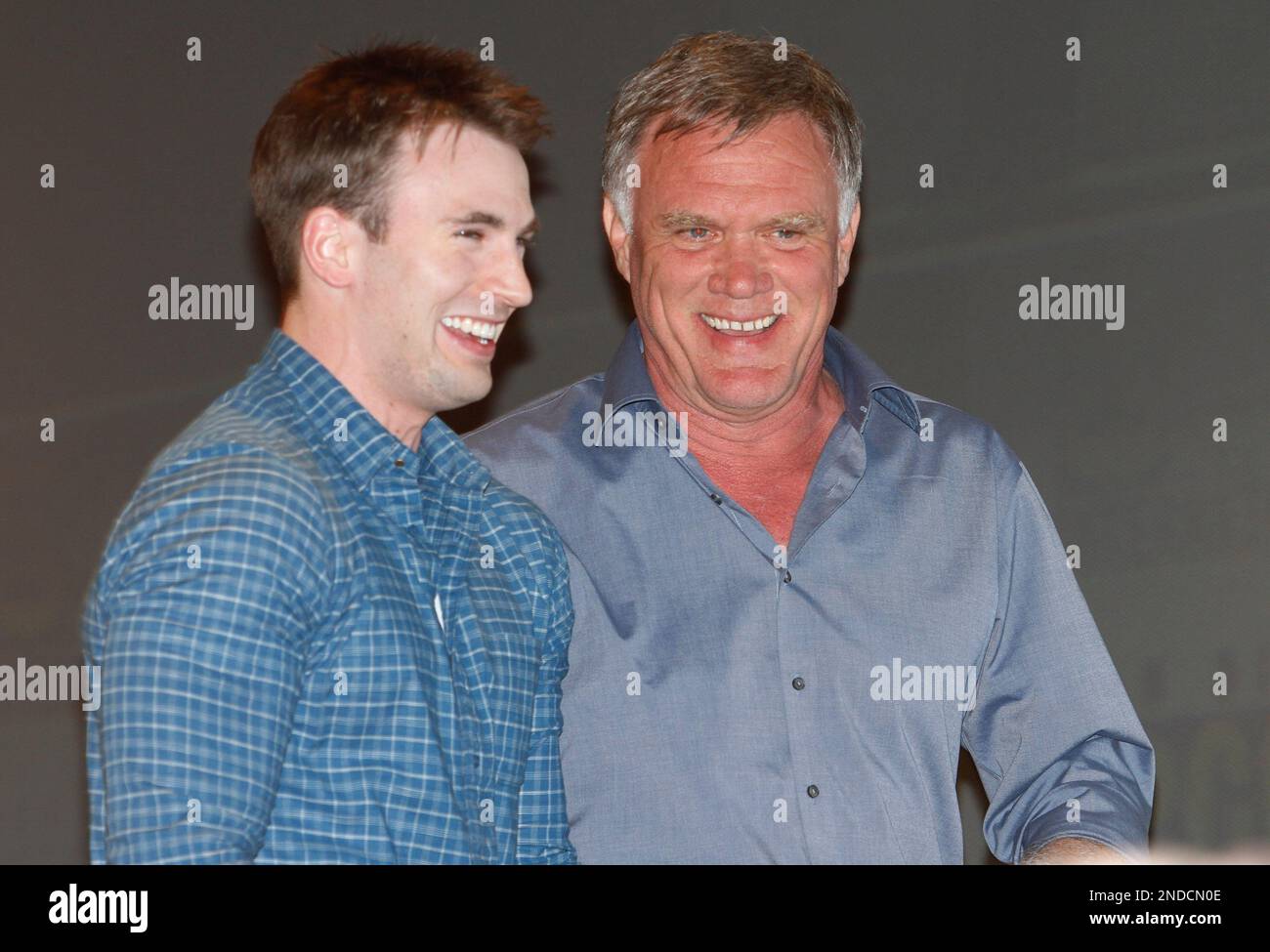 Actor Chris Evans, left, and director Joe Johnston, right, on stage ...