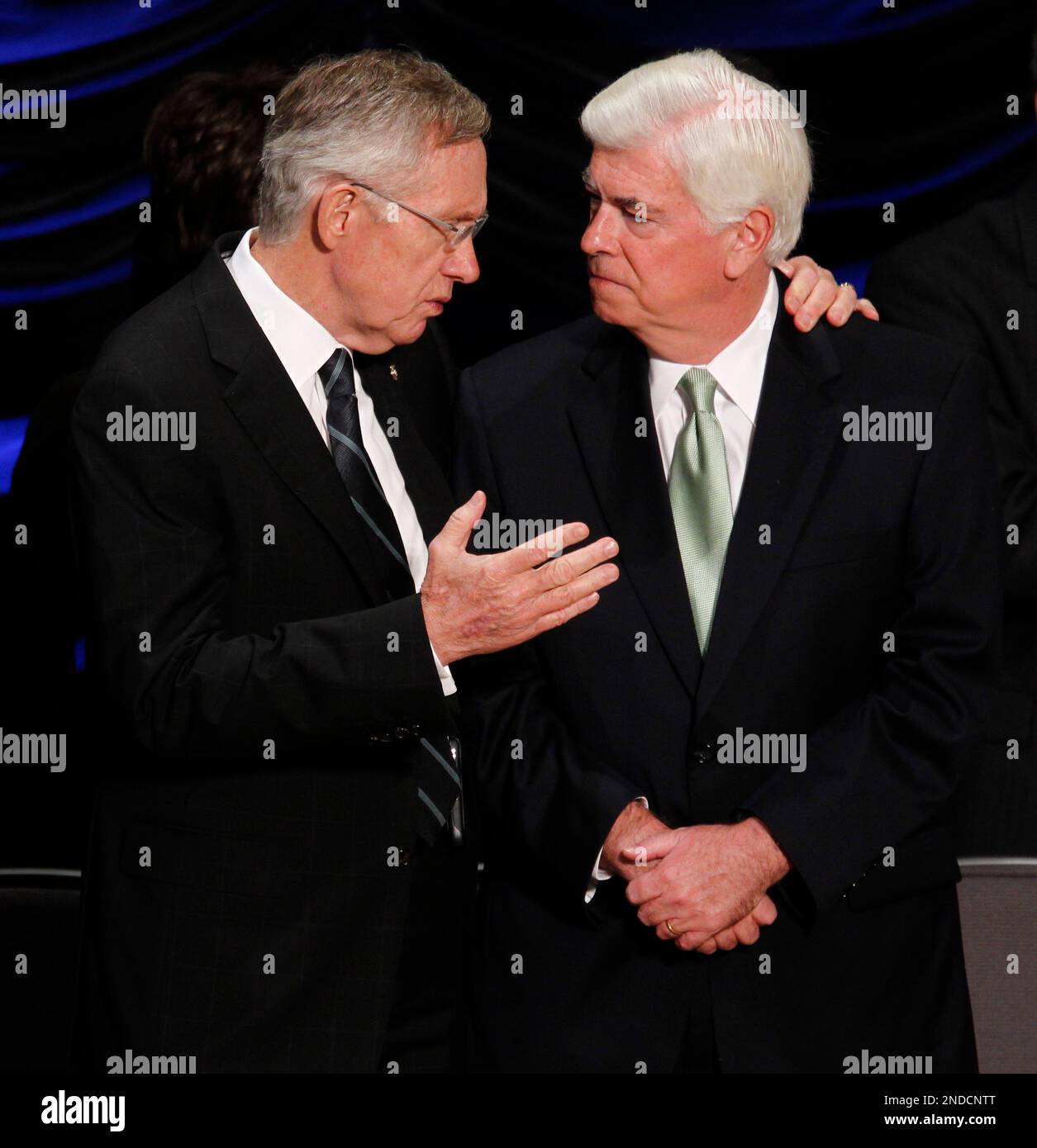 Senate Majority Leader Harry Reid, D-Nev., left, talks with Sen. Chris ...