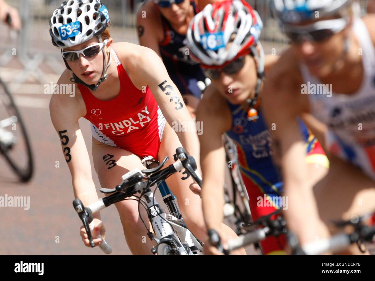 Paula Findlay of Canada, at left rides in the pack during the cycle ...