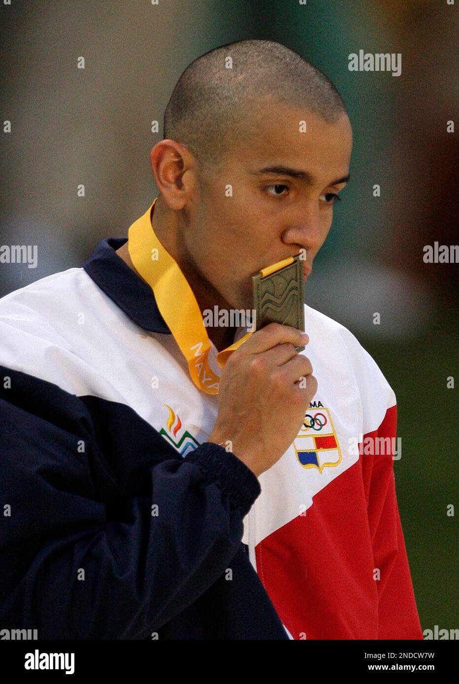 Panama's Edgar Crespo kisses his gold medal during the award ceremony ...