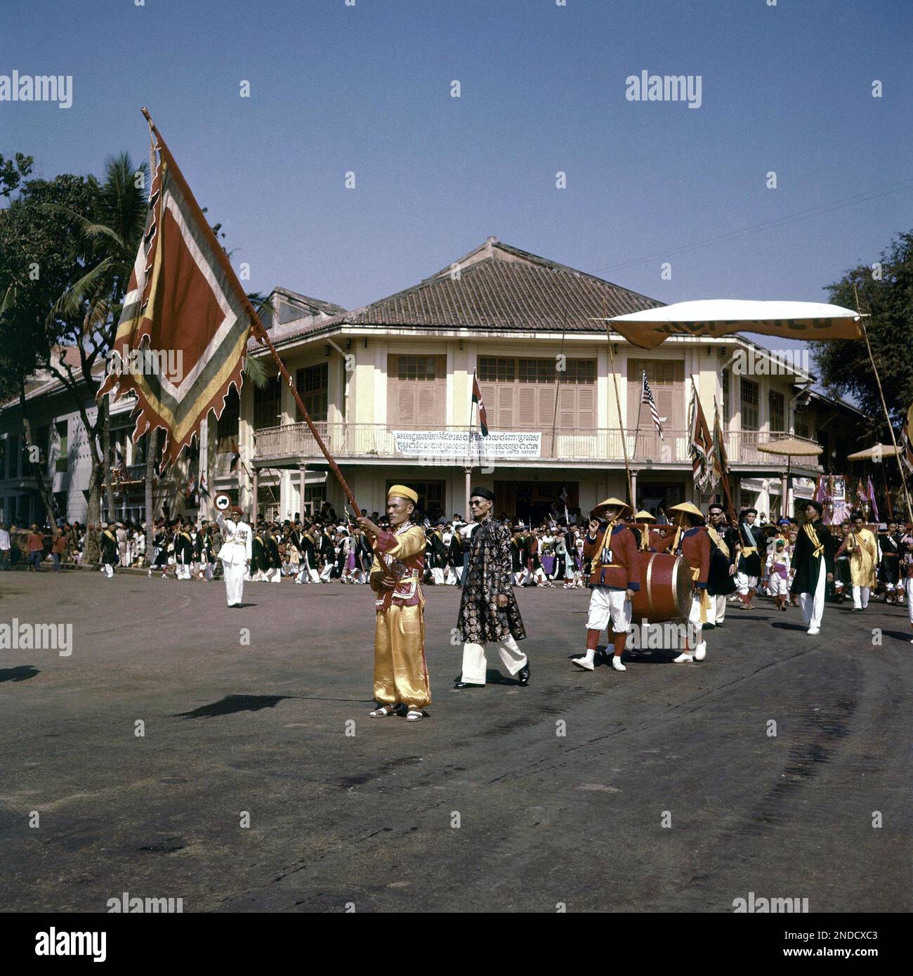 Colorfully attired Cambodians march before their Majesties at Phnom ...