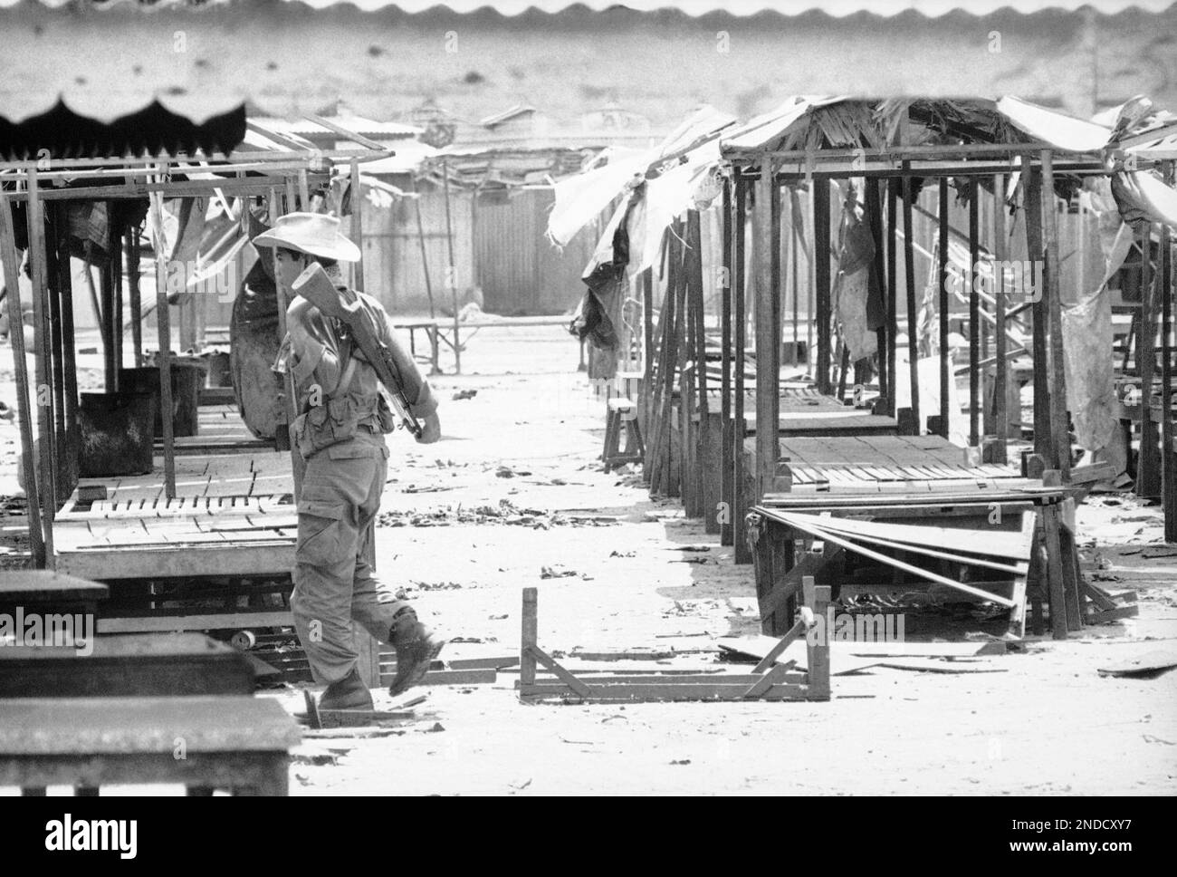 Cambodian soldier, carrying Chinese-made AK-47 assault rifles, enter ...