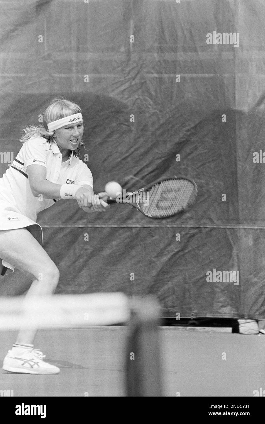Andrea Jaeger of Lincolnshire, Ill., eyes the ball as she reaches to ...