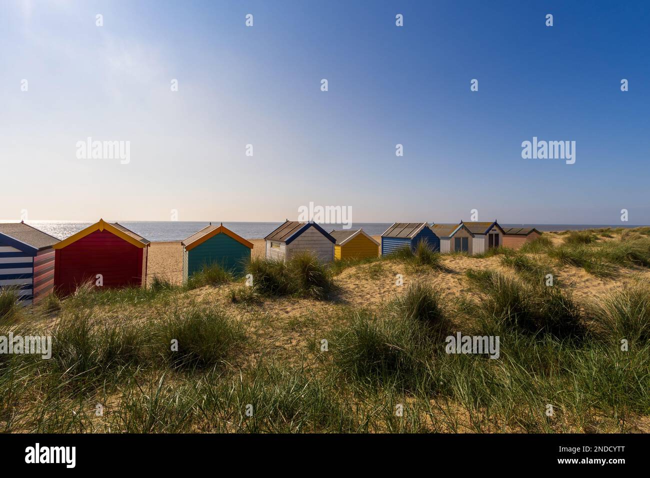 Beach huts with sand dunes at Southwold on the Suffolk coast Stock ...