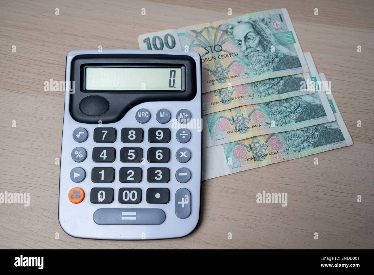 Czech Republic 100 kroner paper banknote and a calculator. King Karel ...