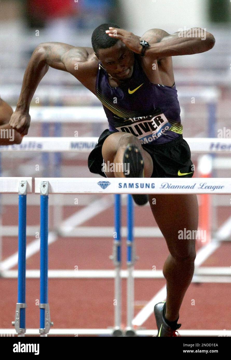 U.S. athlete David Oliver competes to win the Men's 110m hurdles race ...