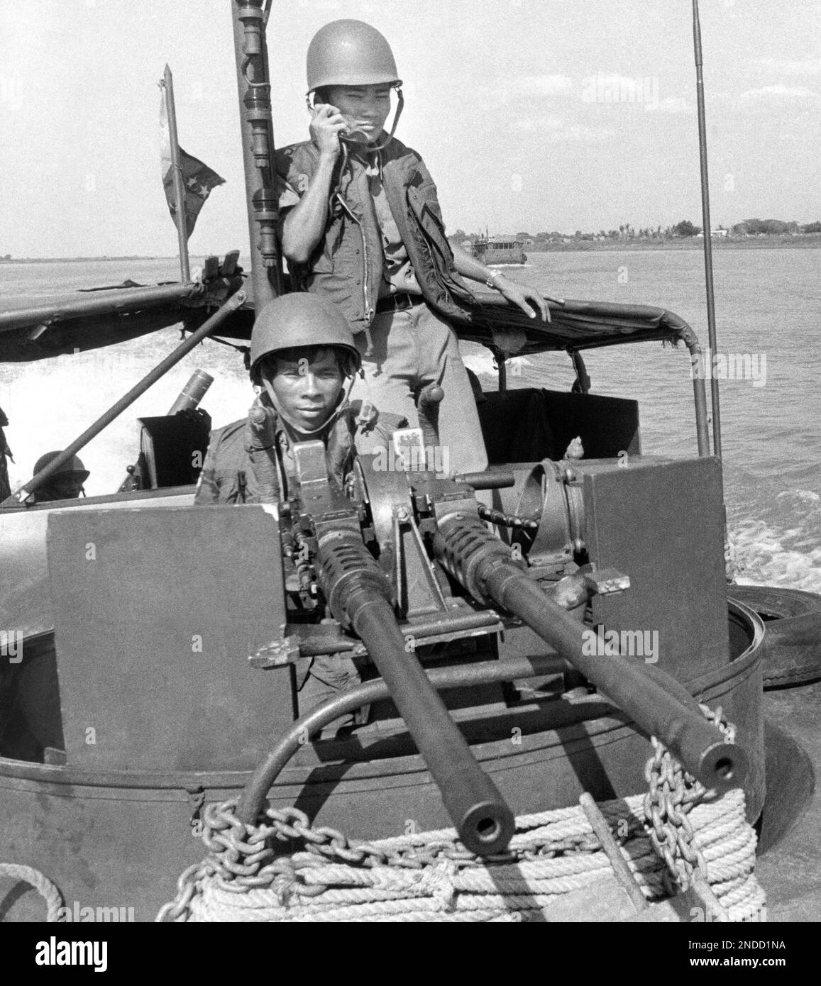 A Cambodian patrol boat cruises down the wide Mekong River southeast of Neak Luong, Cambodia on ...