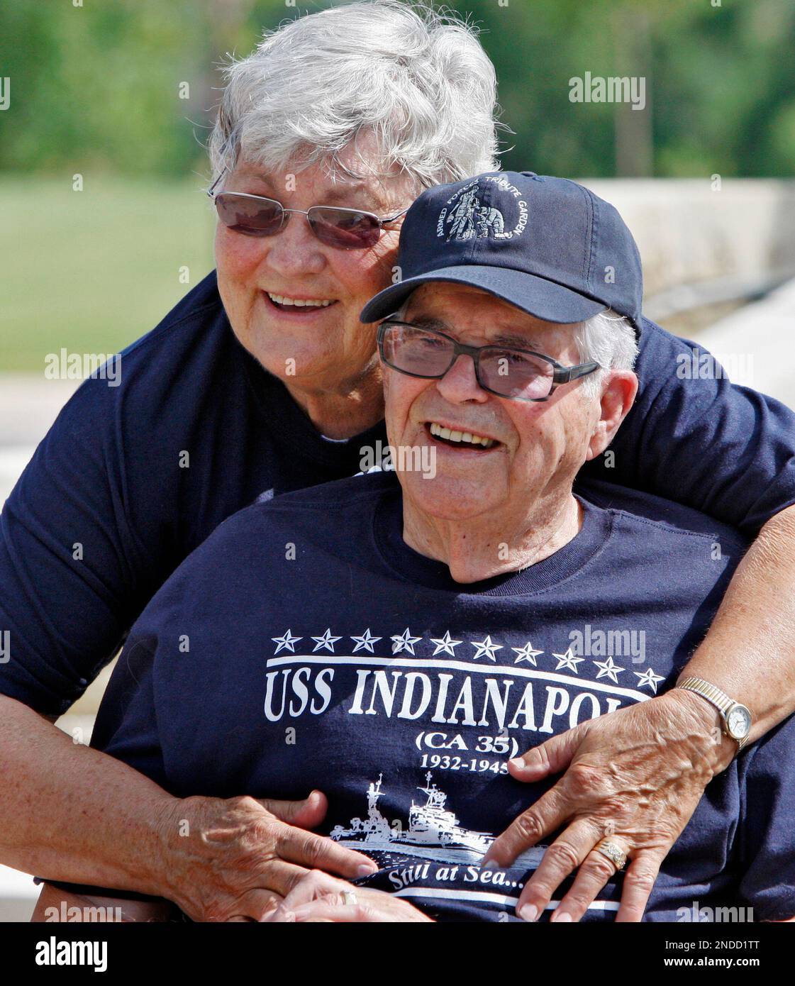 Paul Murphy is hugged by his wife Mary Lou during ceremonies honoring ...