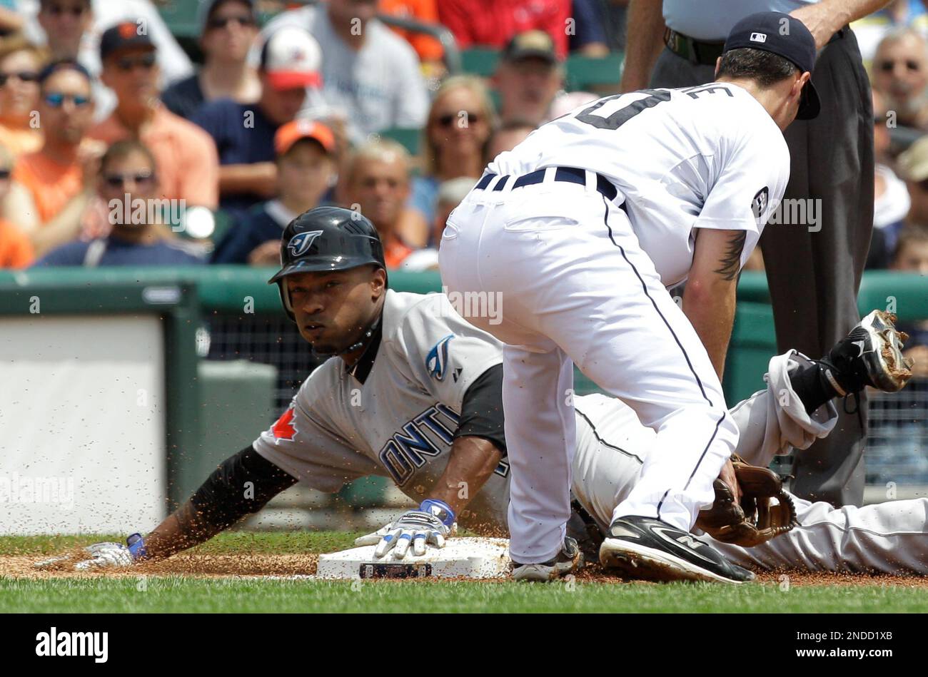 Toronto Blue Jays' DeWayne Wise slides safely into third base with a ...