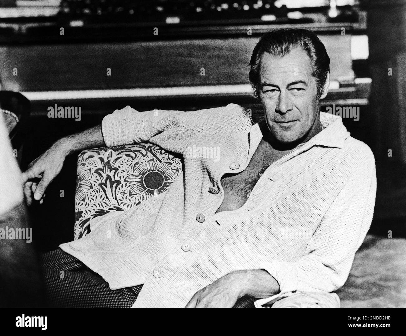 British actor Rex Harrison relaxes on the set of "My Fair Lady" on ...
