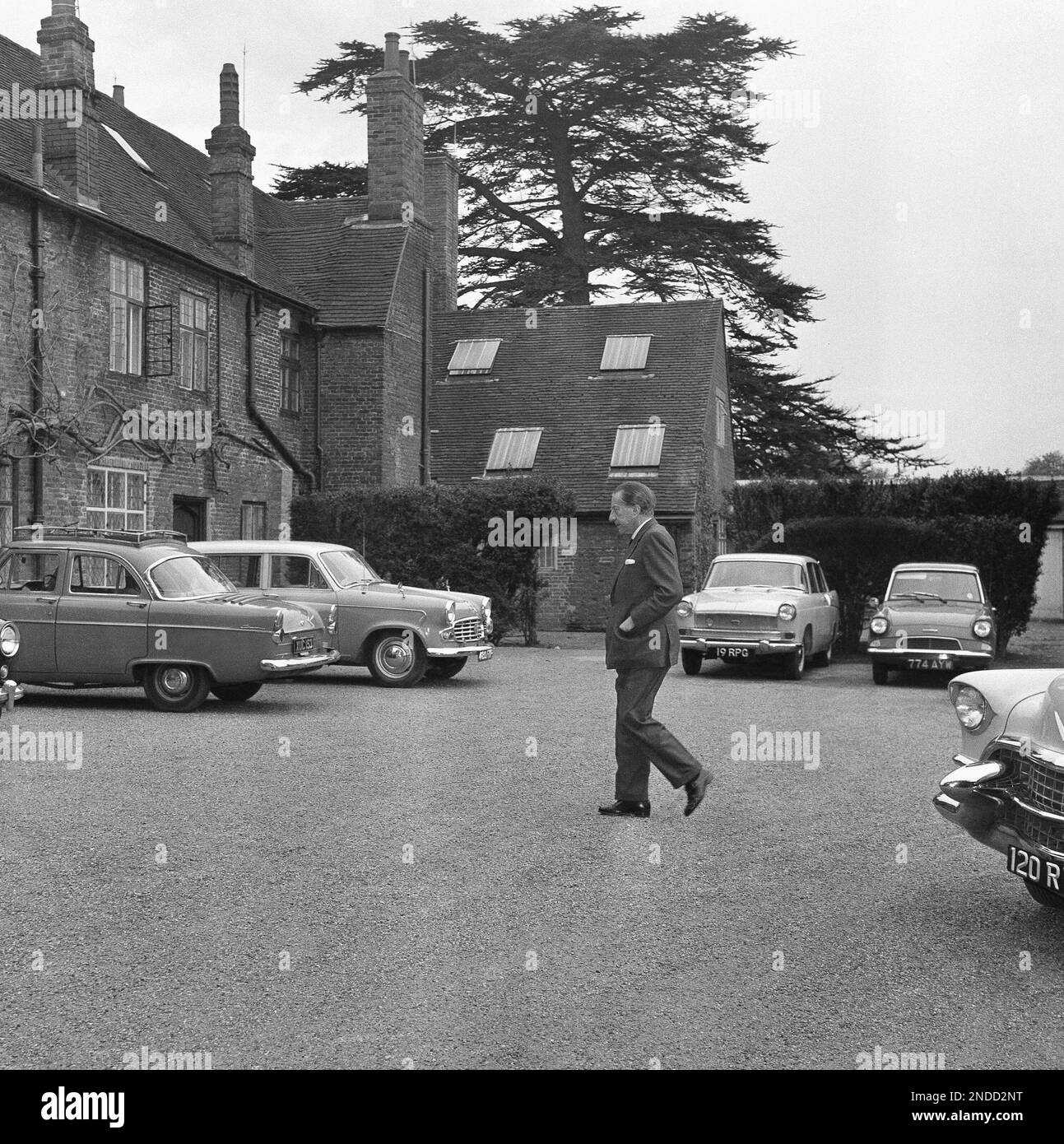 American oilman J. Paul Getty walks toward his palatial home on his ...