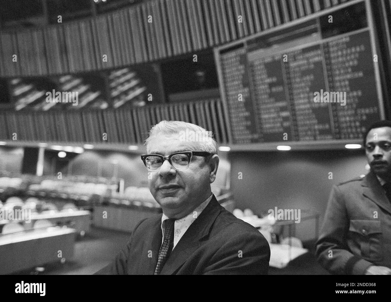 United Nations workers are shown on the floor of the General Assembly ...