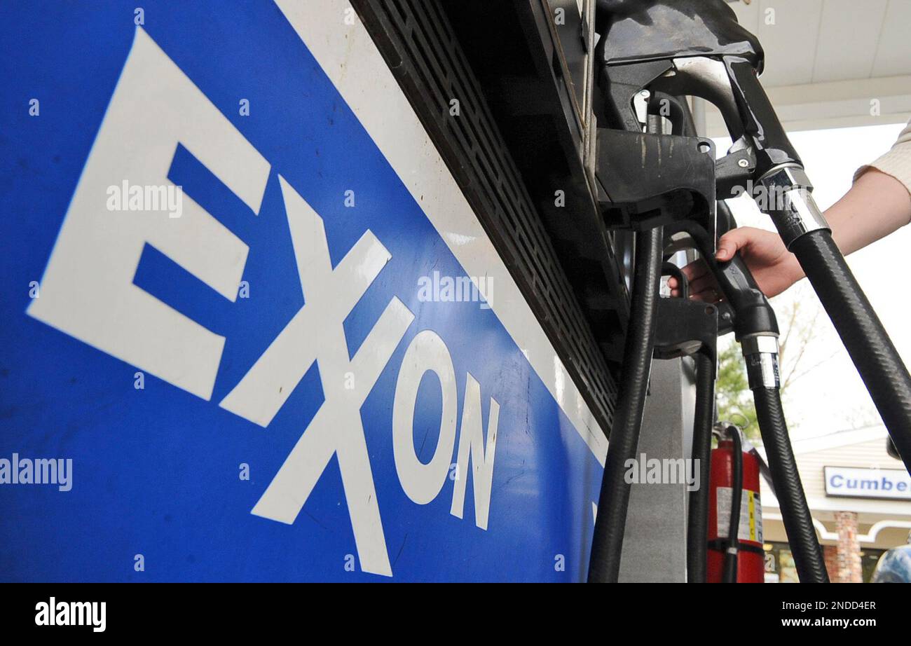FILE - In this May 1, 2008, file photo, a customer pumps gas at an ...