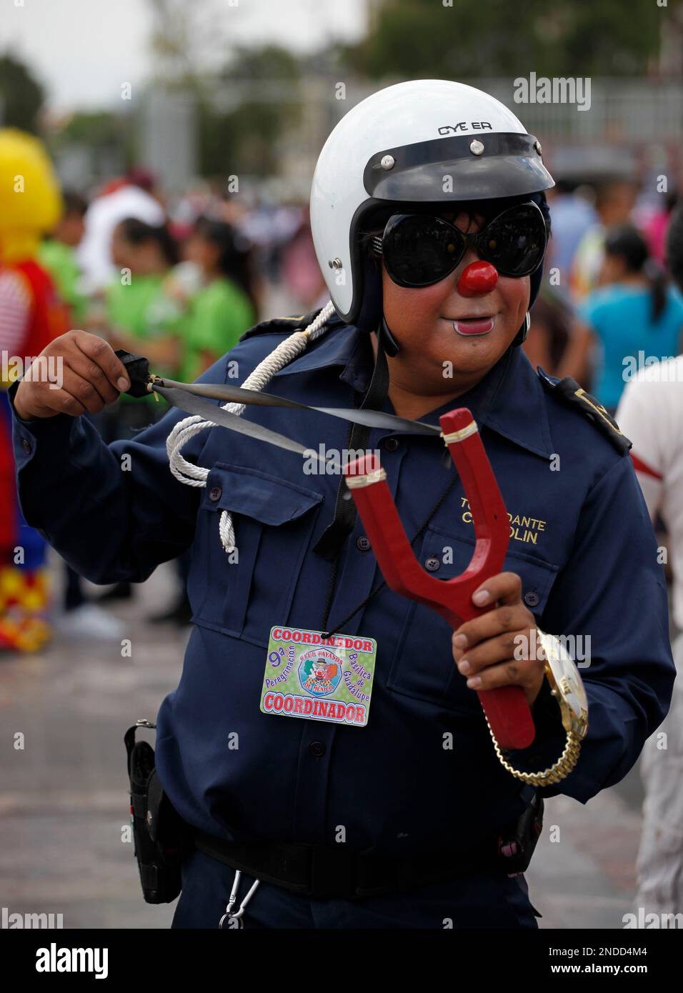 A clown dressed as a police officer gestures during a pilgrimage to the ...