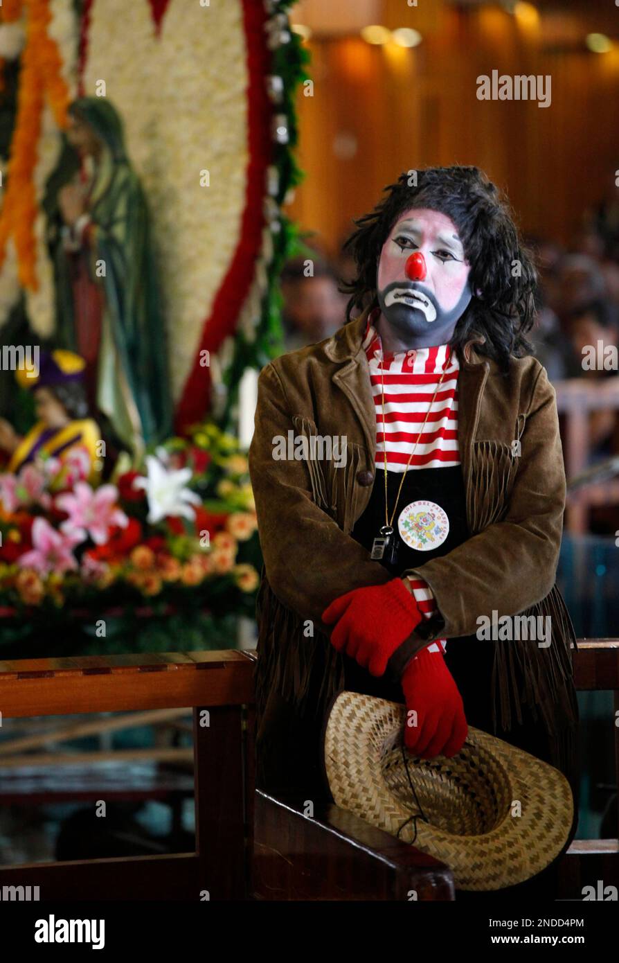 A clown attends a mass at the Basilica of Guadalupe in Mexico City ...