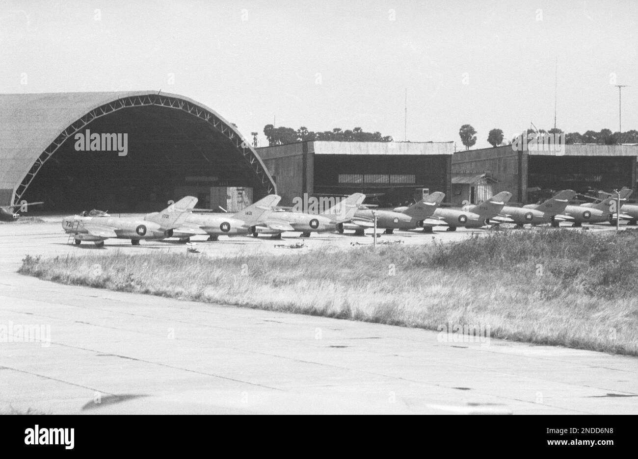Cambodian MIG-17 jet fighters are lined up near hangars airport at ...