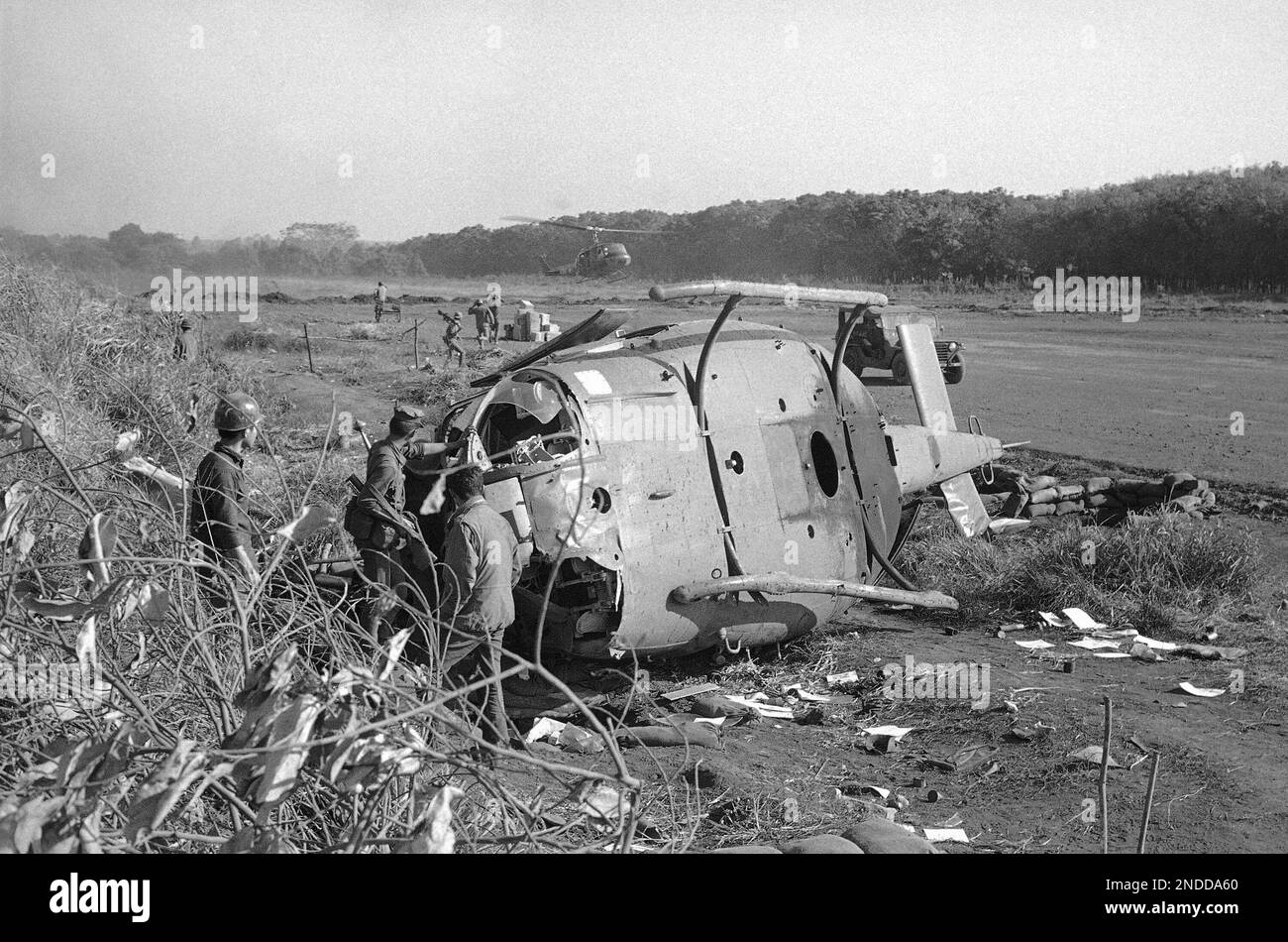 South Vietnamese troops look inside U.S. army medivac helicopter that ...