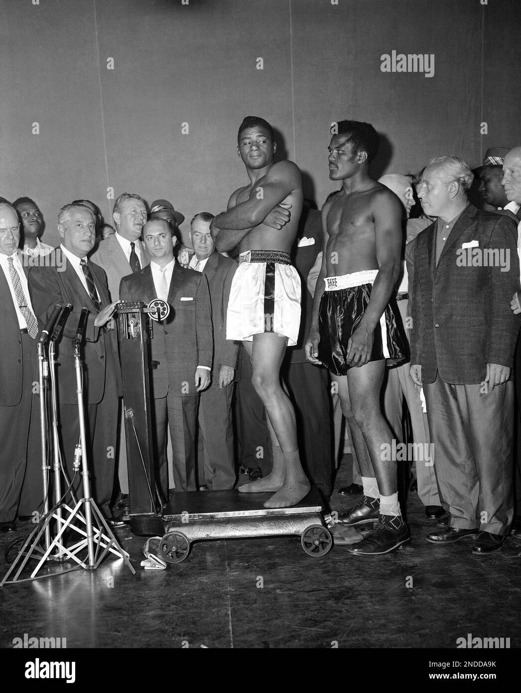 Floyd Patterson, world’s heavyweight boxing champion, stands on scale ...