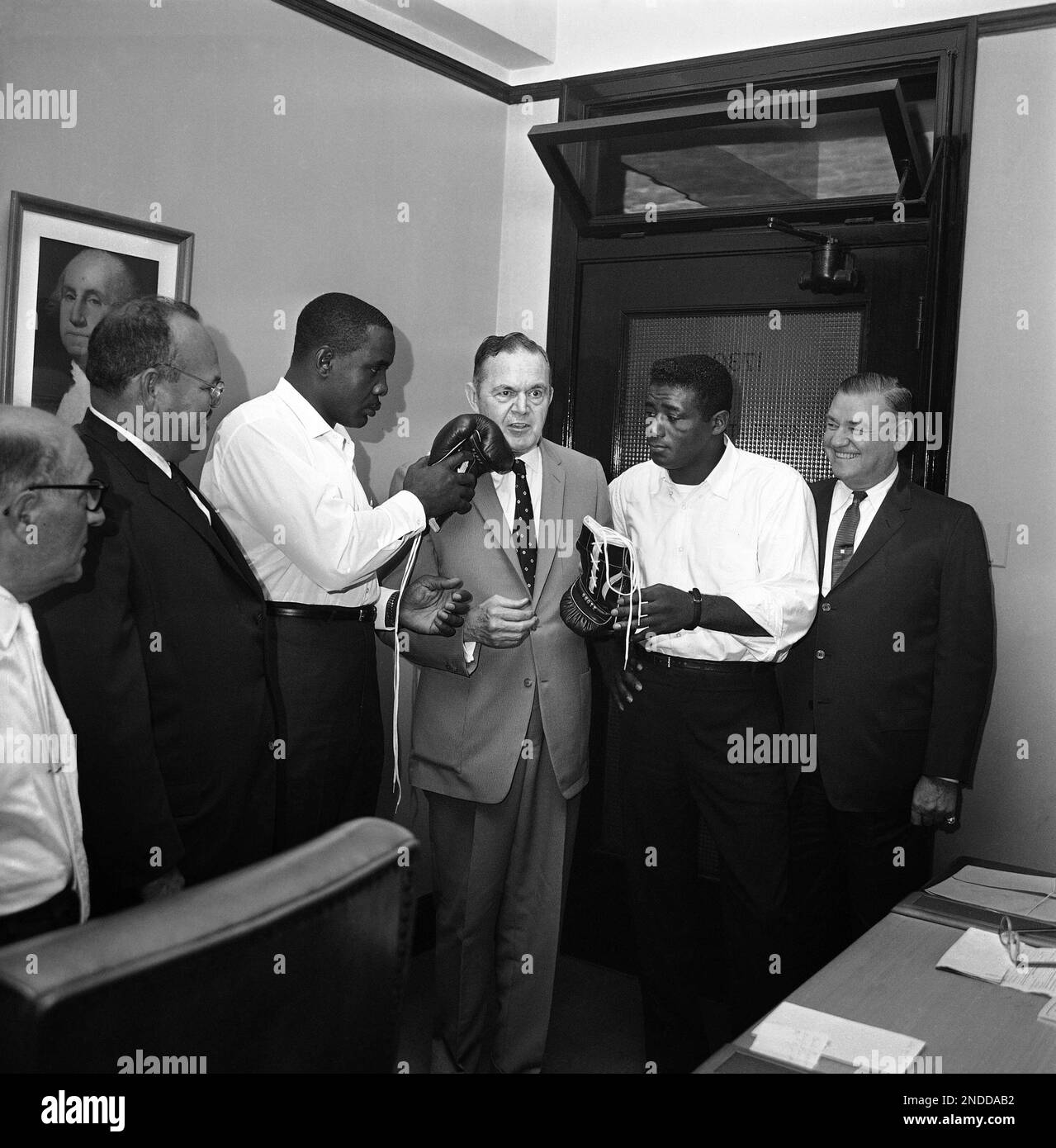 Joseph Triner, center, chairman of the Illinois Athletic Commission ...