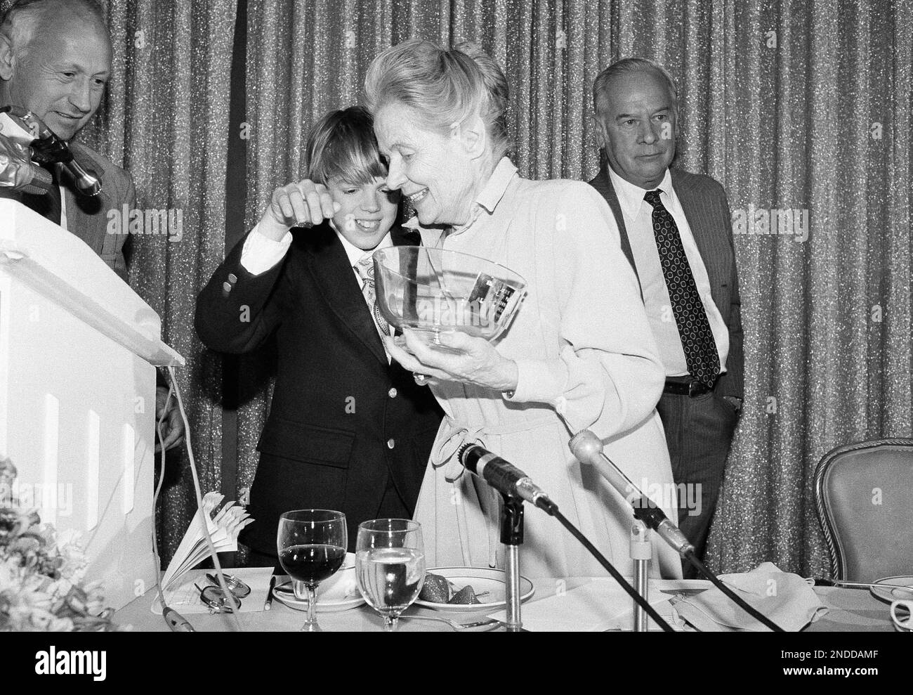 Sweden’s Alva Myrdal holds the Albert Einstein Peace Prize as she hugs ...