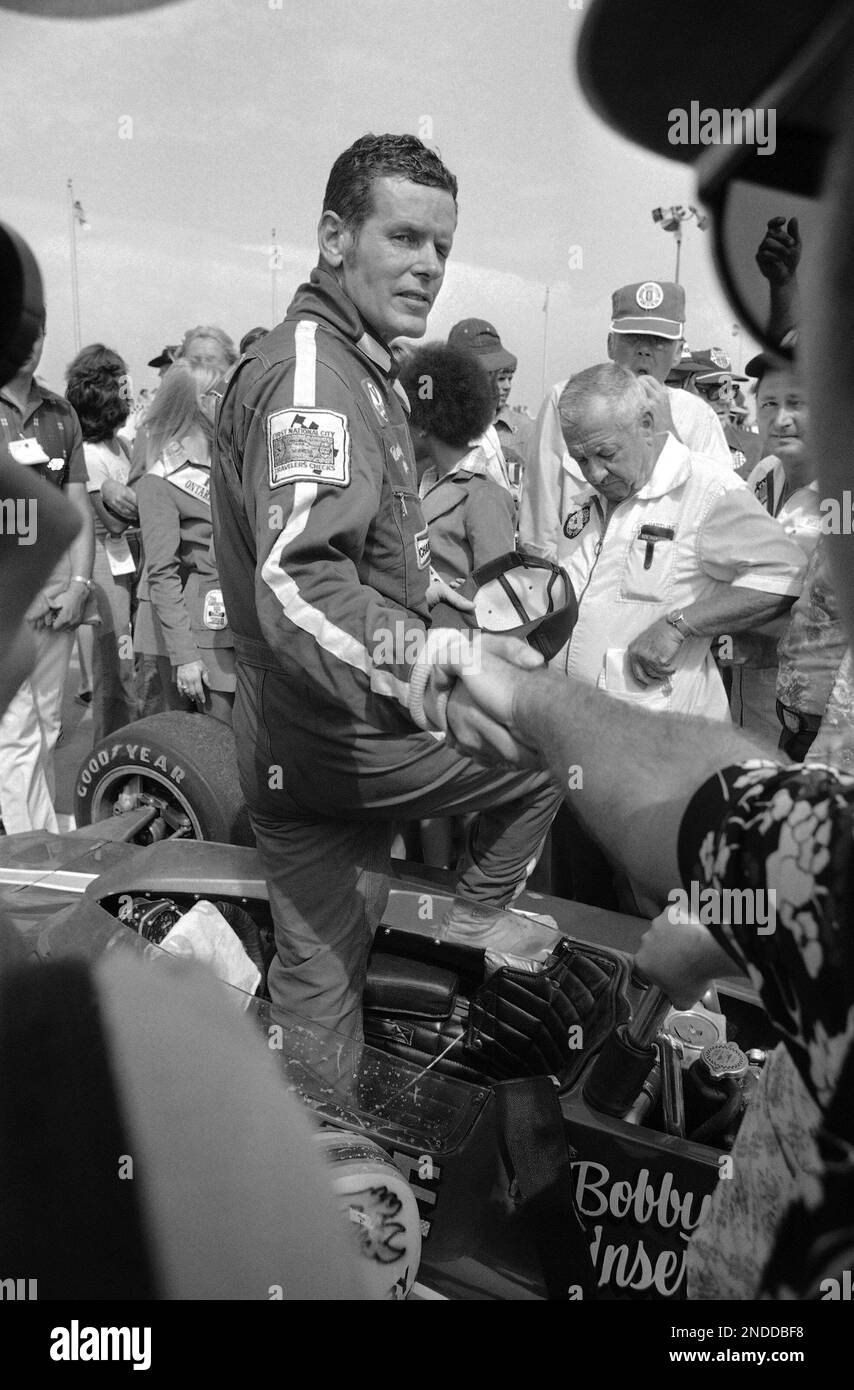Bobby Unser gets congratulations in the winner's circle after taking ...