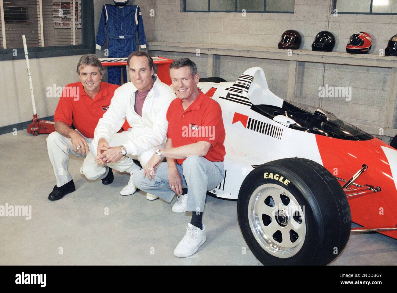 Champion race car drivers Rick Mears, left, and Bobby Unser, right ...