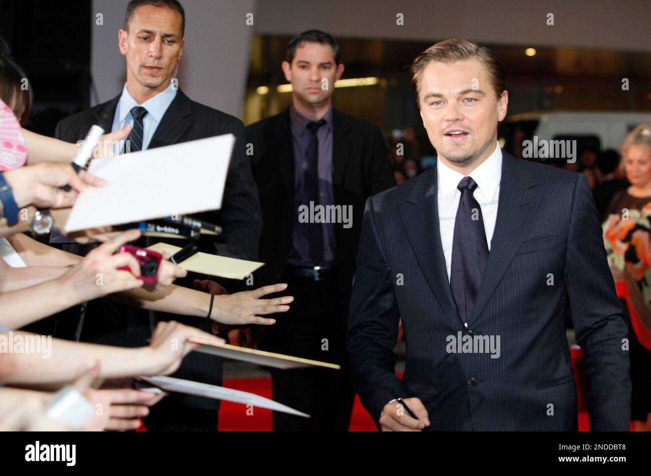 U.S. actor Leonardo DiCaprio prepares to sign his autographs for his ...