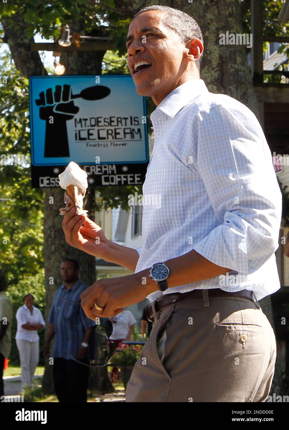 President Barack Obama holds a coconut ice cream cone after he visits ...