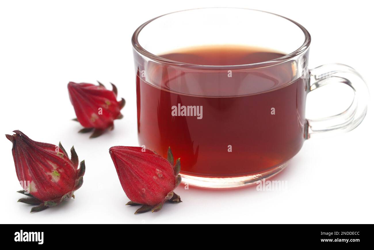 Roselle tea in a cup over white background Stock Photo - Alamy