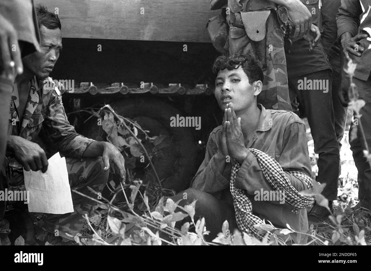 A Cambodian Khmer rouge (Communist) soldier begs for mercy during ...