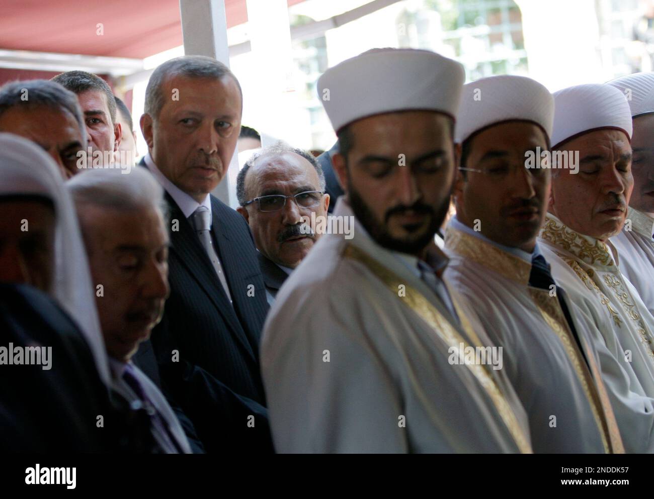 Turkish Prime Minister Recep Tayyip Erdogan, third from left, attend funeral prayers for Osman ...