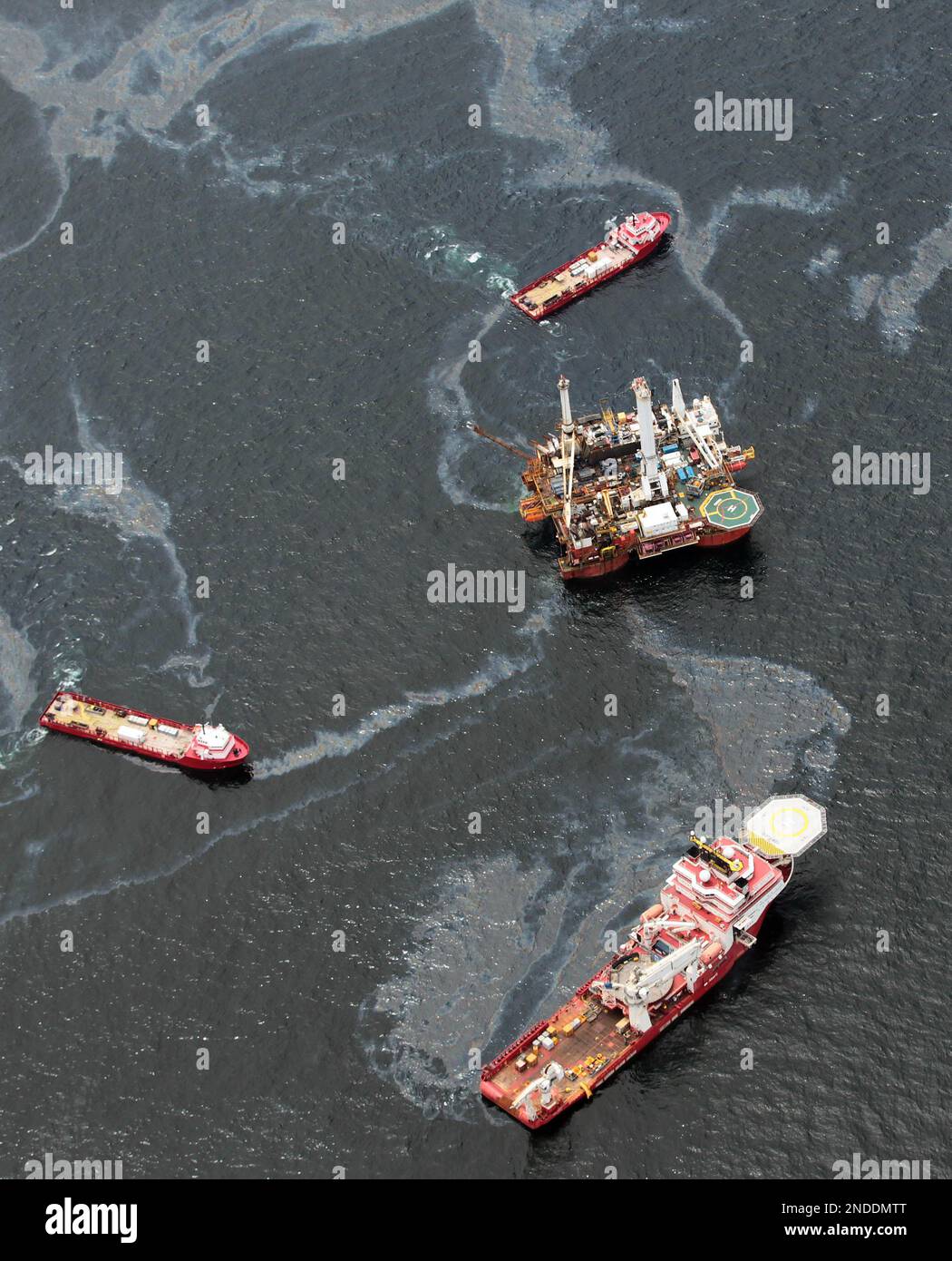 Workboats operate near the Transocean Development Drilling Rig II at ...