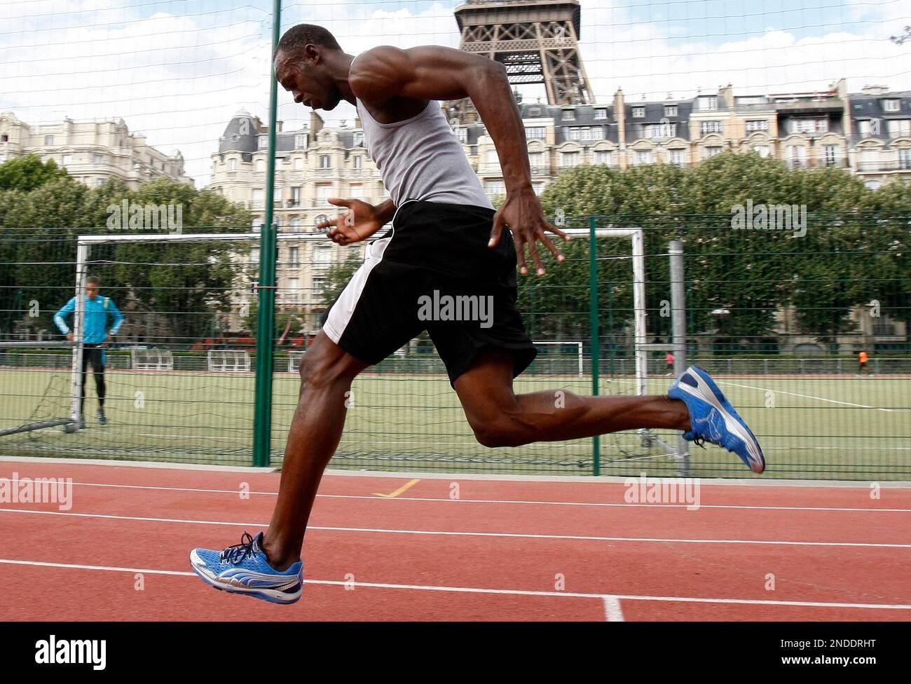 Jamaican sprinter Usain Bolt attends a training session next to the ...