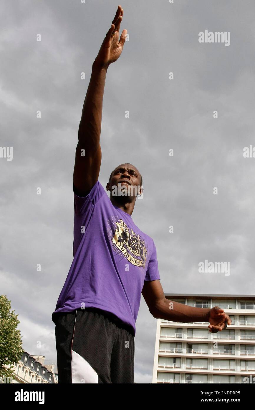 Jamaican sprinter Usain Bolt gestures during a training session next to ...