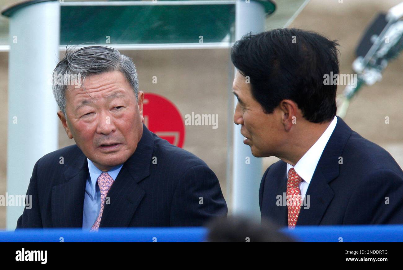 LG Group Chairman Koo Bon-moo, left, talks with company CEO Peter Bahn ...