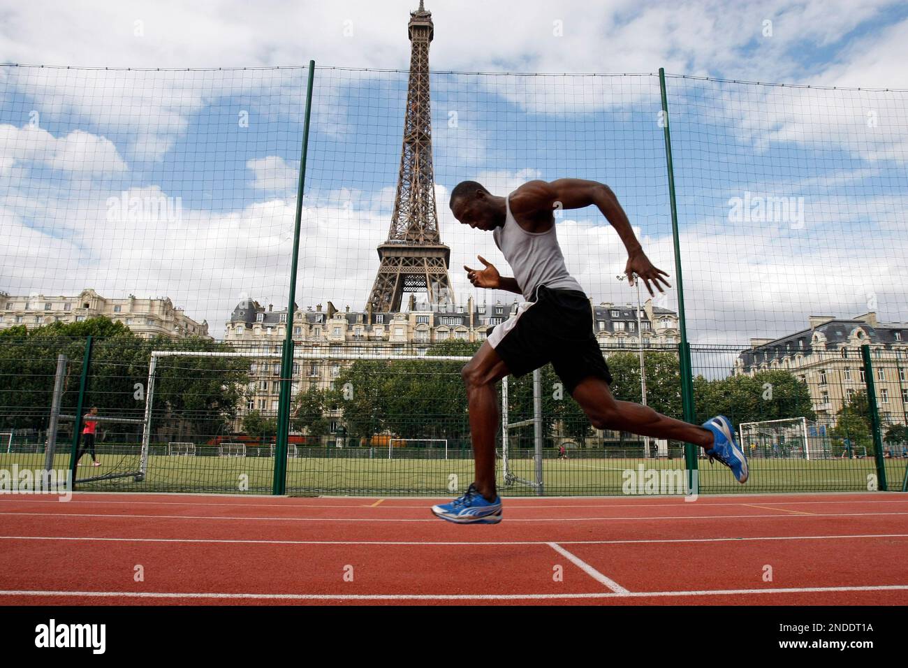 Jamaican sprinter Usain Bolt attends a training session next to the ...