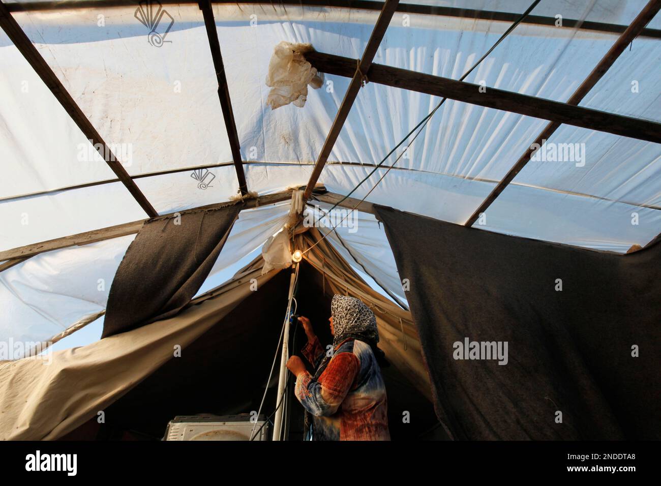 Palestinian Wafa Awaja, 34, is seen in a tent, part of the makeshift ...