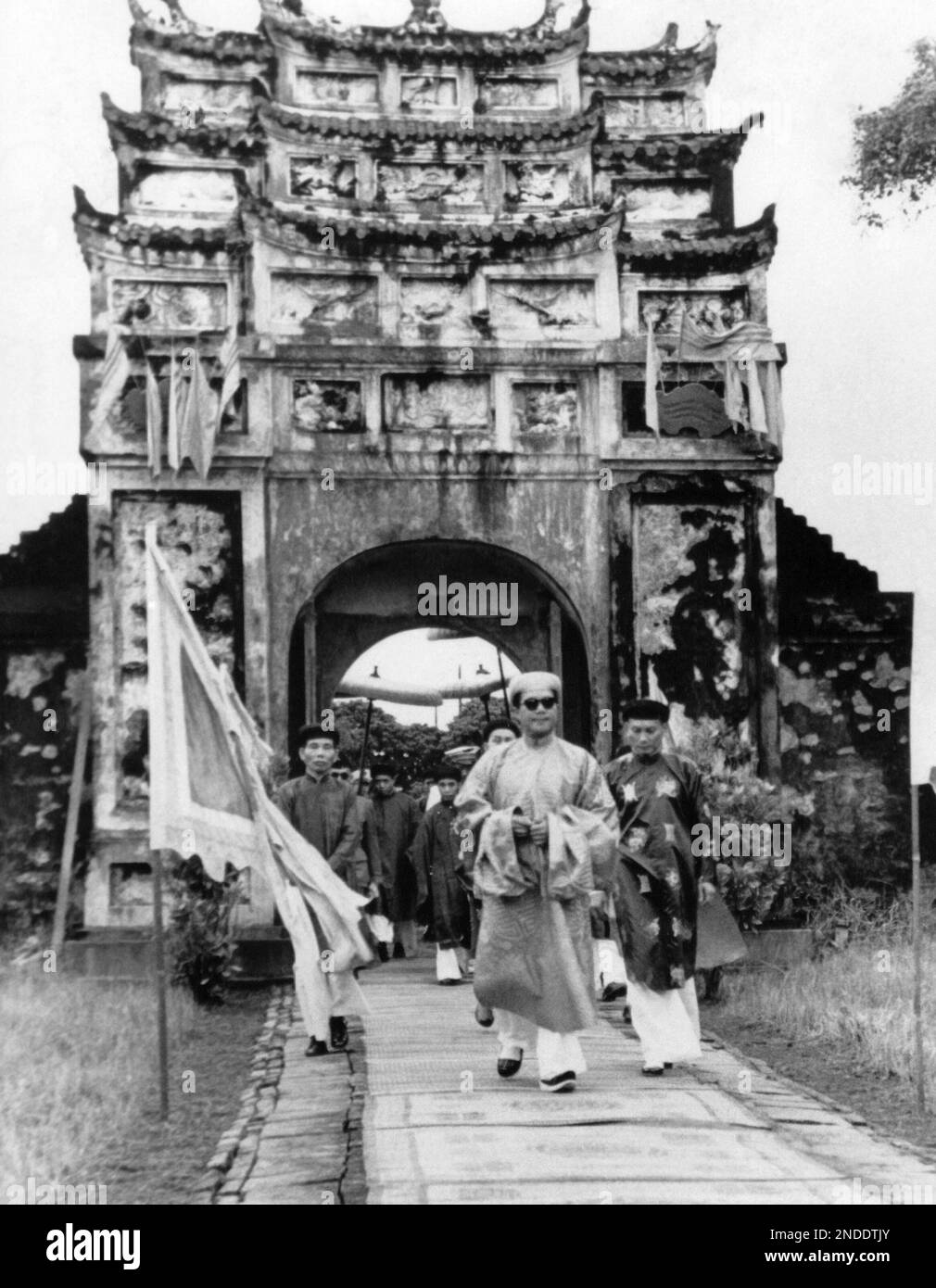 Emperor Bao Dai of Indo-China in full ritual dress as he passes through ...