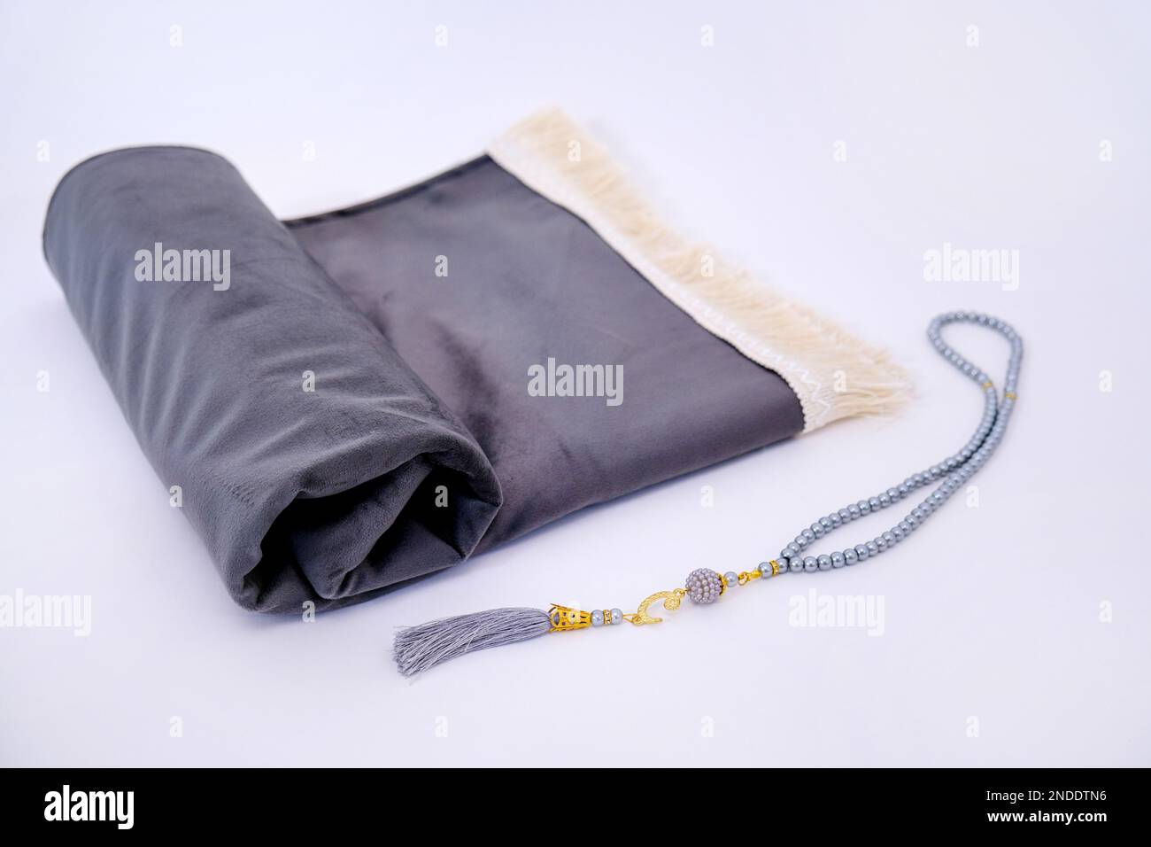 praying mat top view white background. Islamic shop items Stock Photo ...