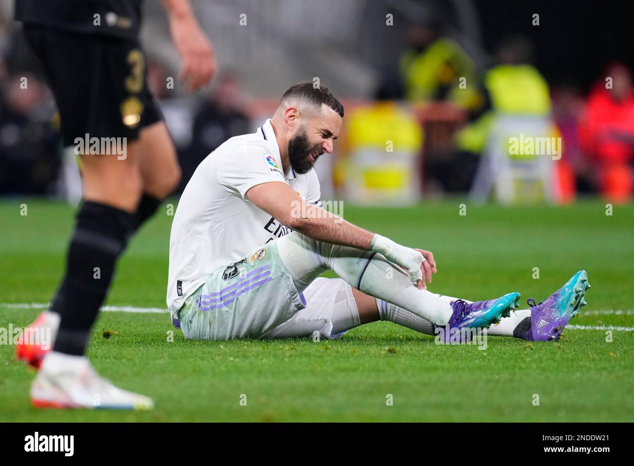 Real Madrid's Karim Benzema grimaces in pain during Spanish La Liga ...