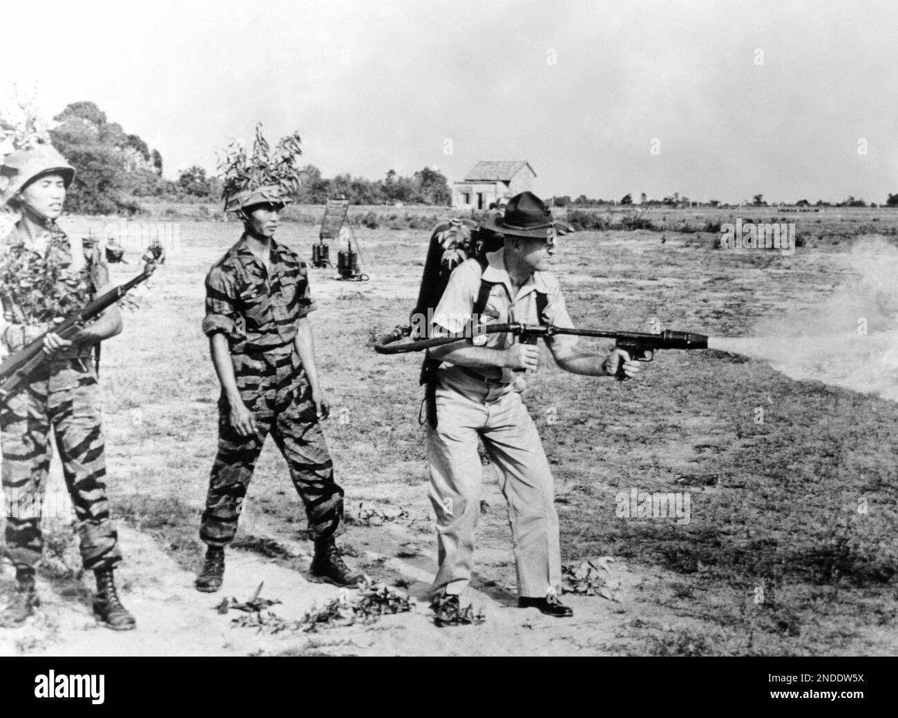 A U.S. Marine Capt. William F. Bethel, right, shows how to use ...